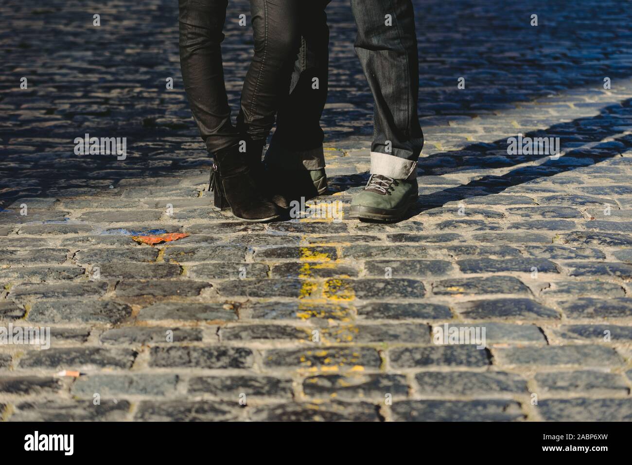 Couple in love embraced in an urban scene, lower half body photo, legs ...