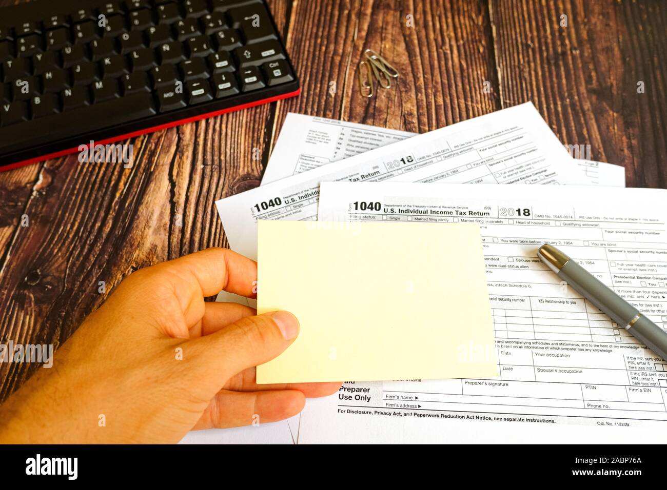 Yellow blank reminder card, held by a citizen on the day of tax payment ...
