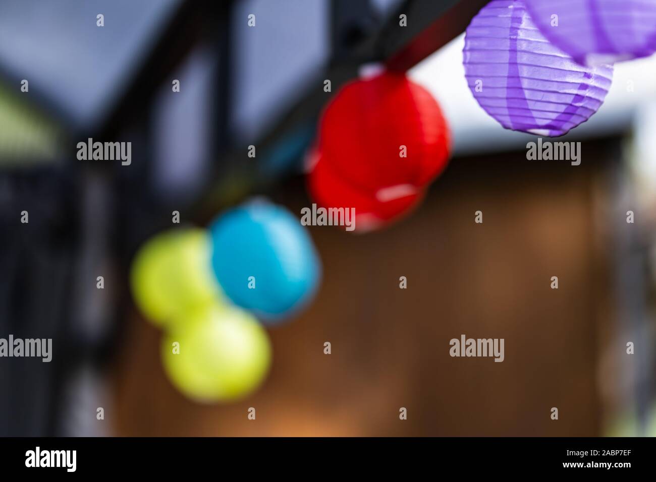 Little colorful lampion lights hanging on a pavilion in a garden on a ...