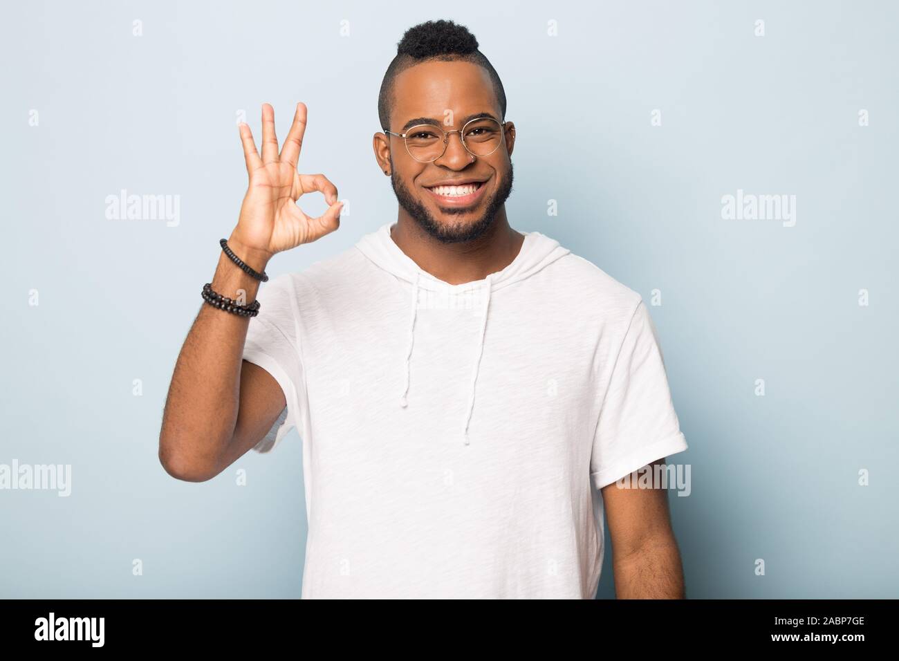 Happy smiling African American man, satisfied client showing ok gesture ...