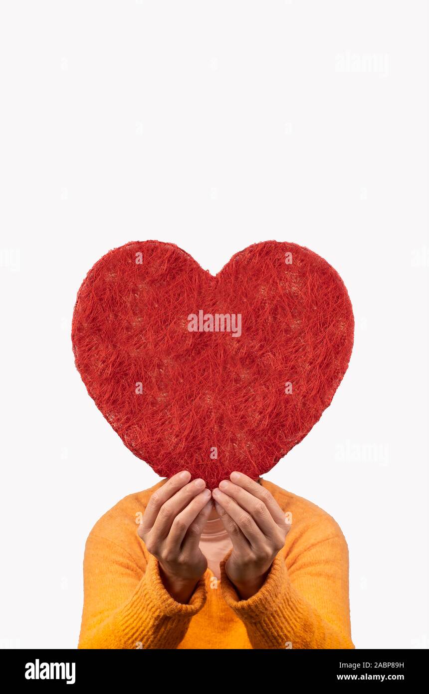 Heart between hands hi-res stock photography and images - Alamy