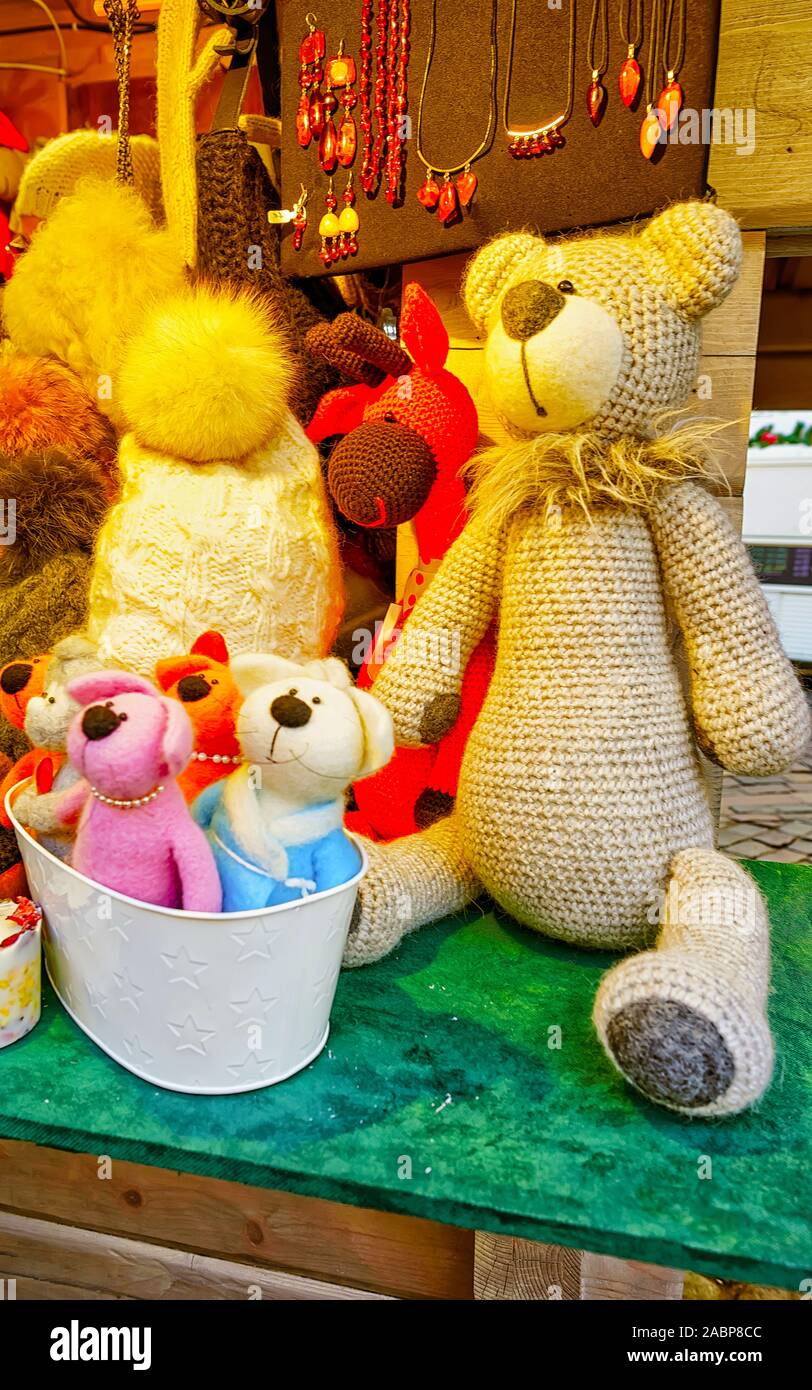 Handmade teddy bears and hats displayed at Riga Christmas market reflex ...