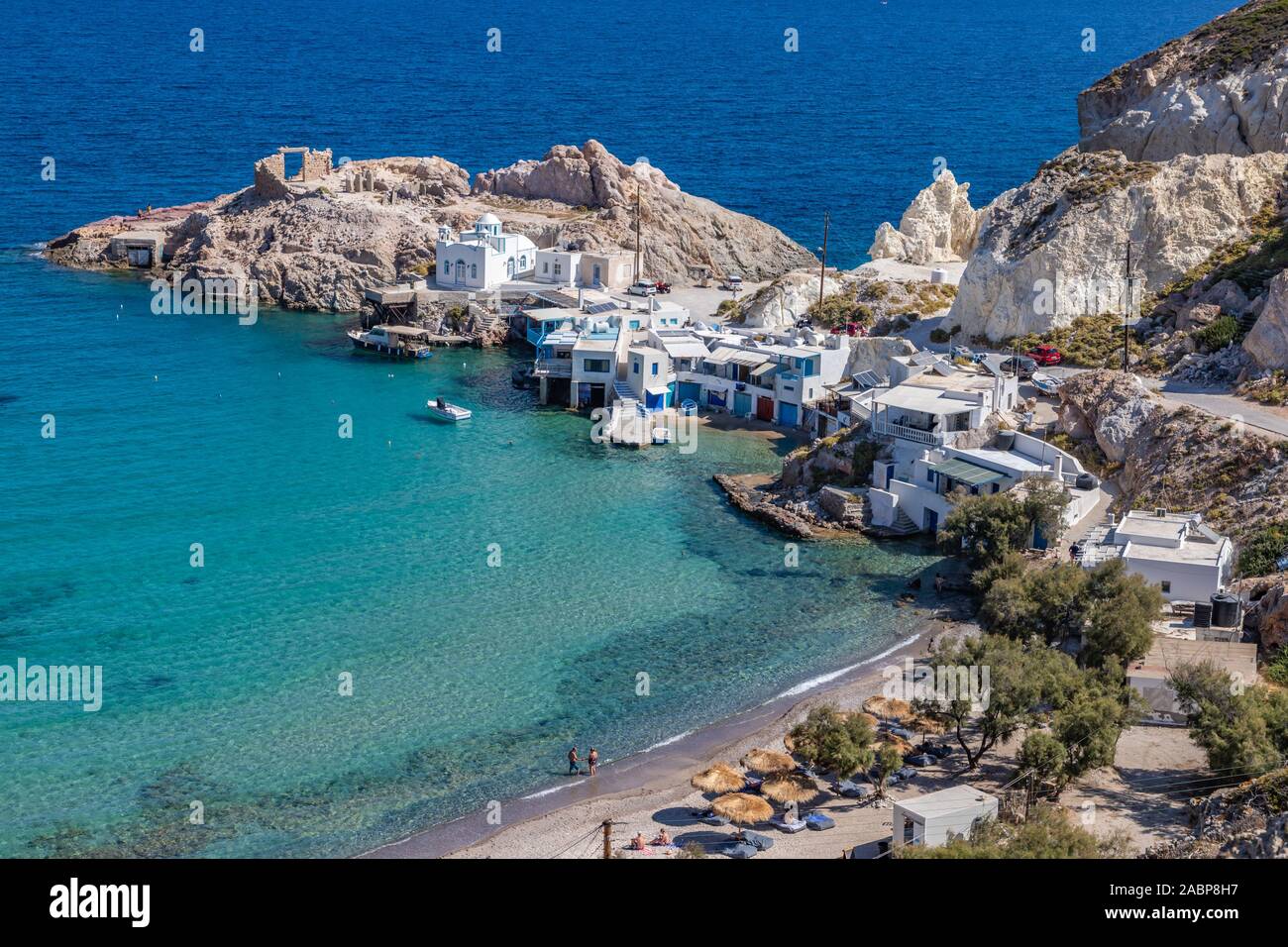 Firopotamos beach with church, houses and cliffs, Milos, Greece Stock ...