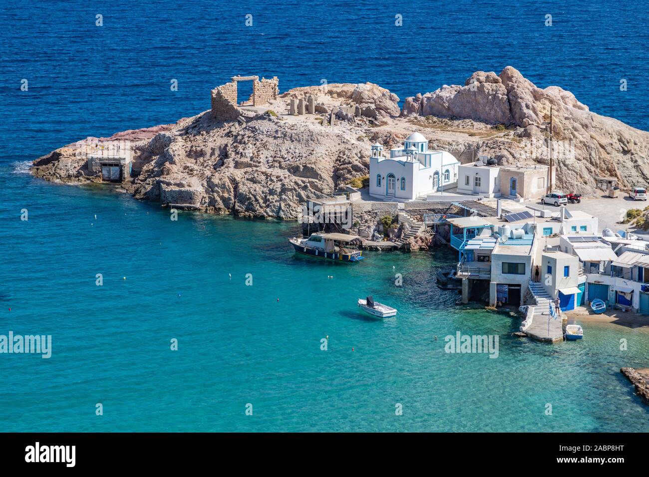 Firopotamos beach with church, houses and cliffs, Milos, Greece Stock ...