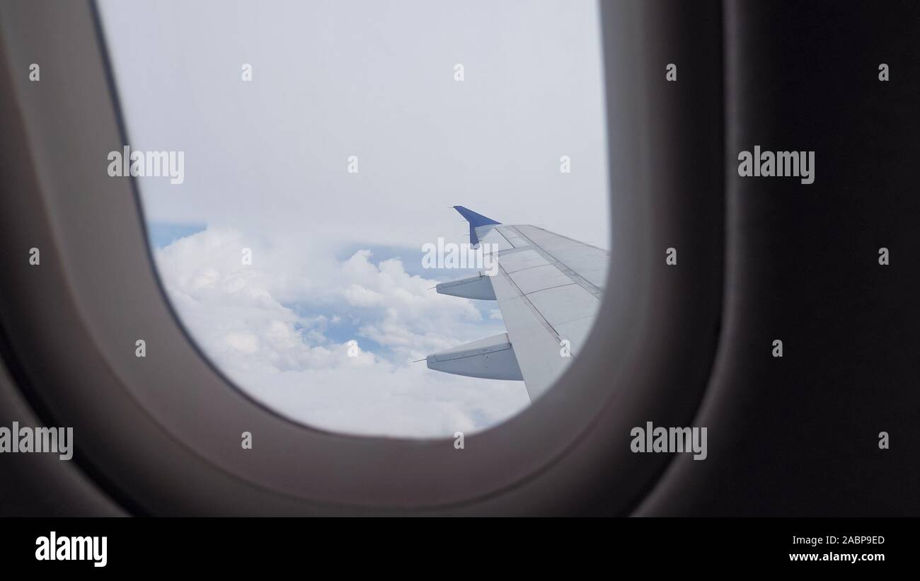 Flight during overcast weather. View from the window of the airplane on ...
