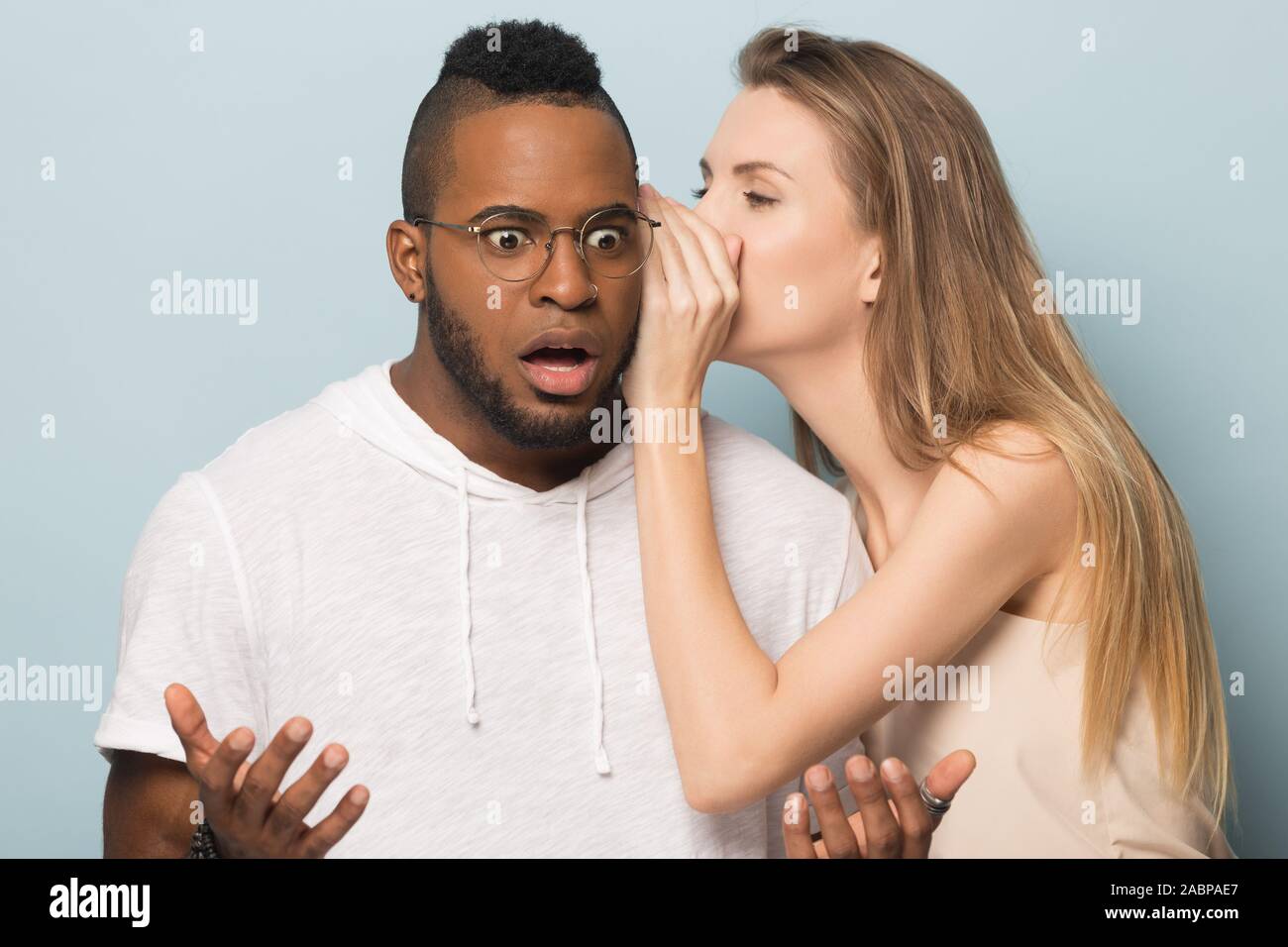 Woman whispering in ear of man hi-res stock photography and images - Alamy