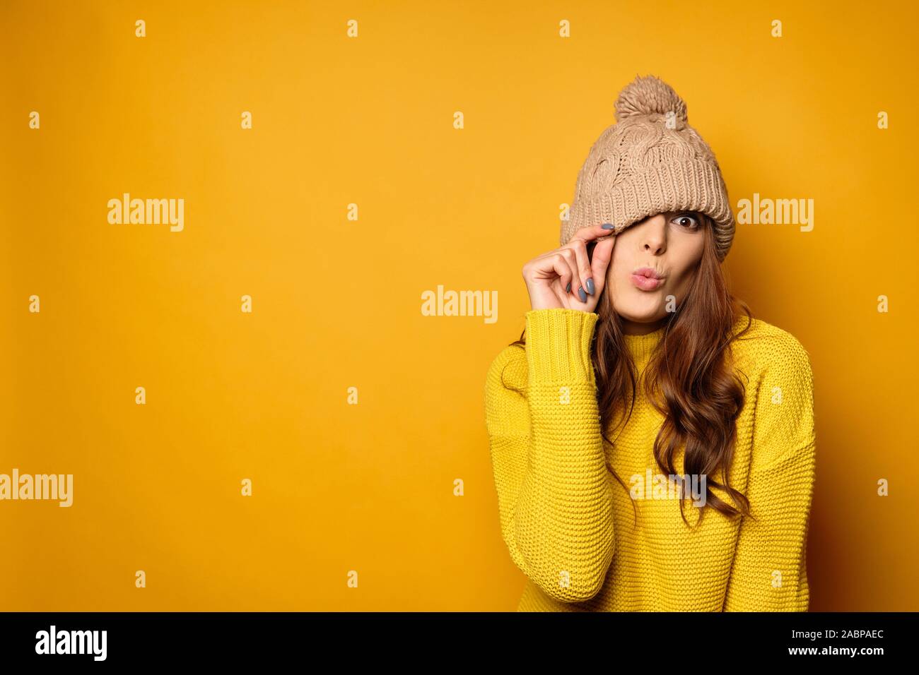 Woman pulling sweater over face hi-res stock photography and images - Alamy