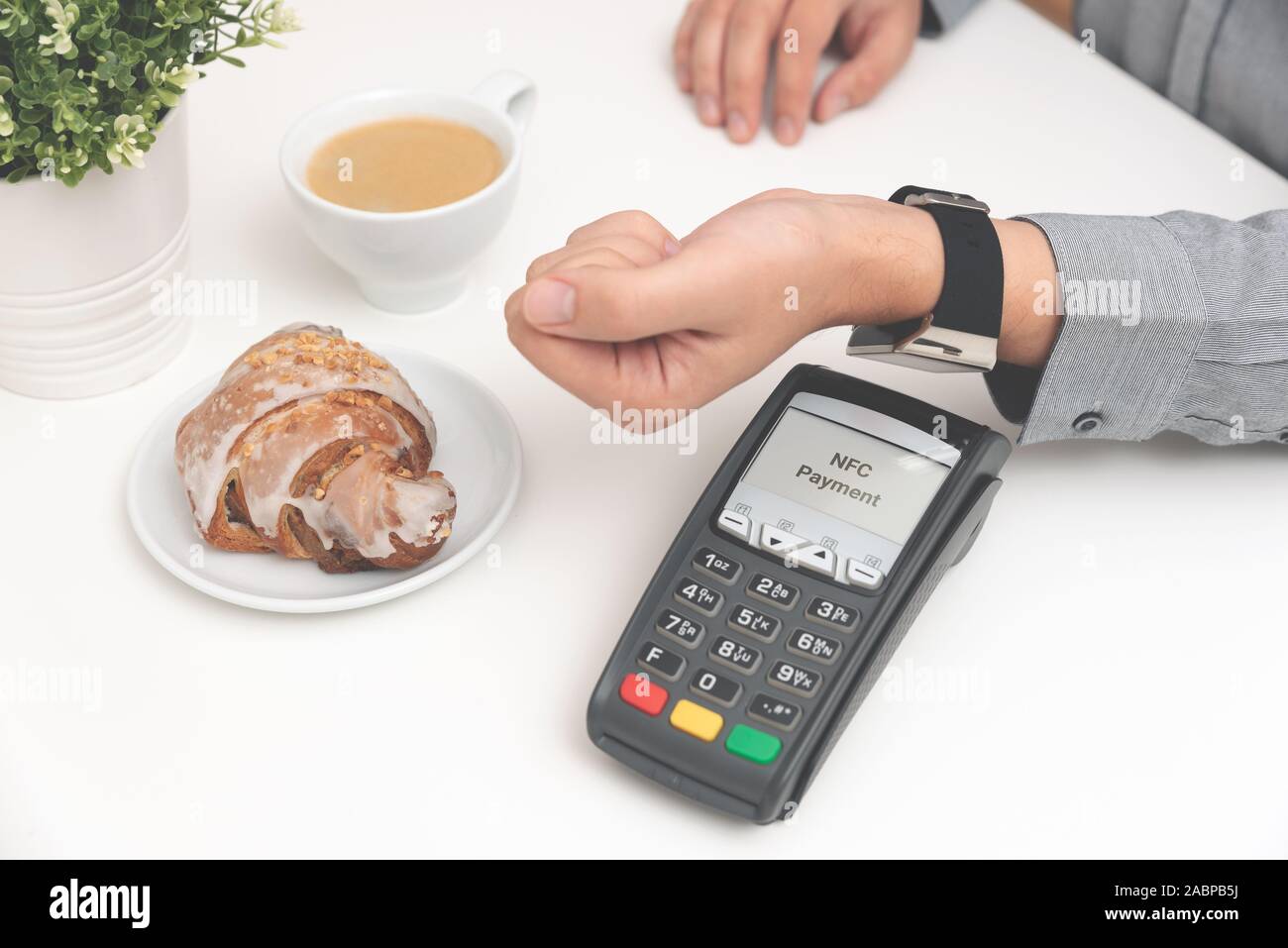 Contactless payment using smartwatch hi-res stock photography and ...