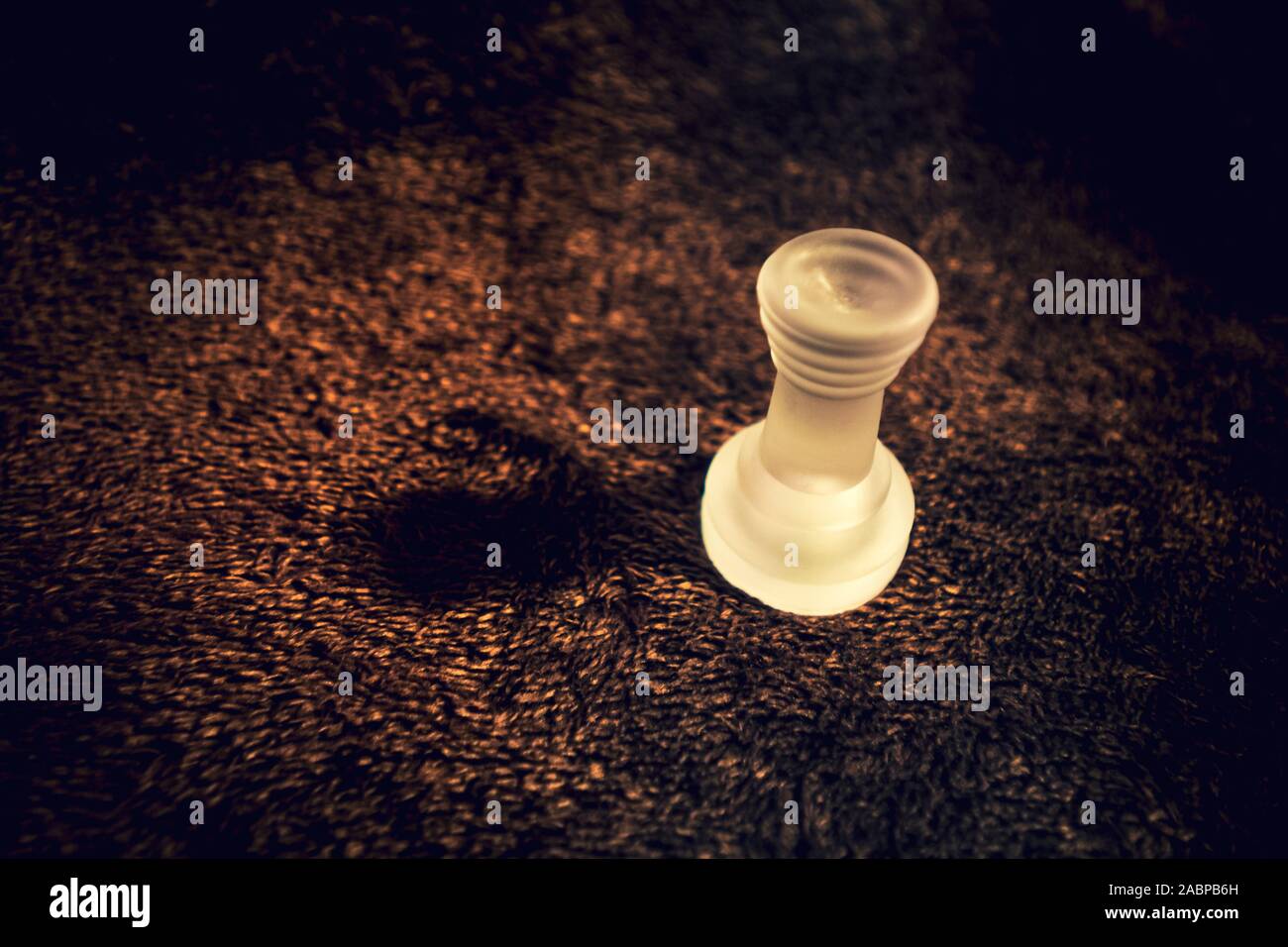 Frosted Rook chess piece on dramatic background Stock Photo - Alamy
