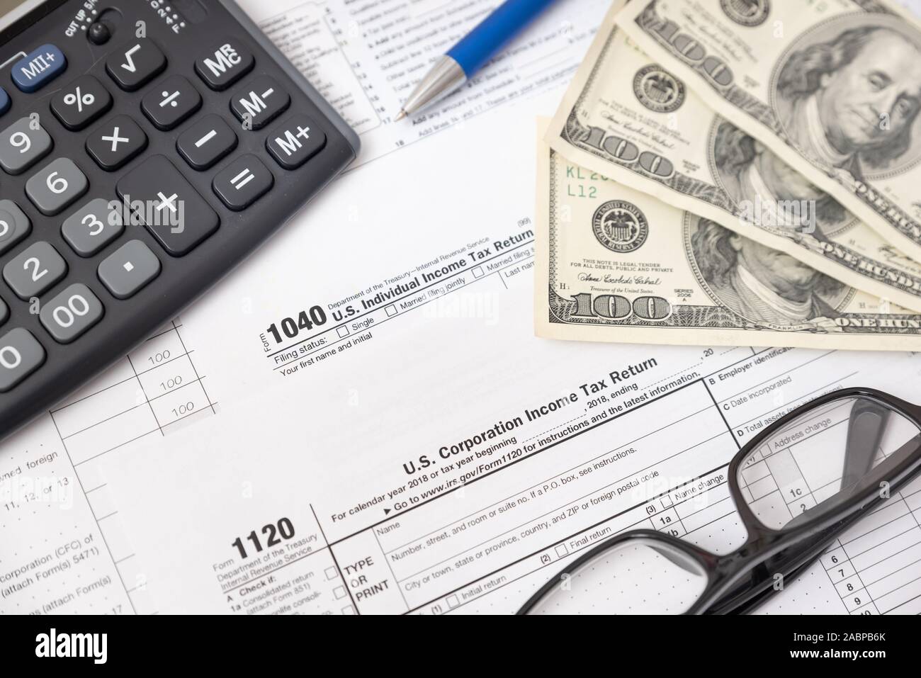 US tax form on desk composition. Tax income concept Stock Photo - Alamy