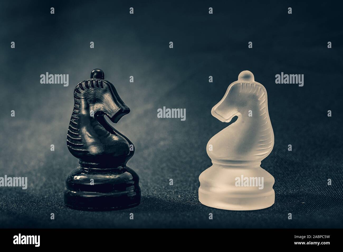 Opposing Knights face there differences face to face Stock Photo - Alamy