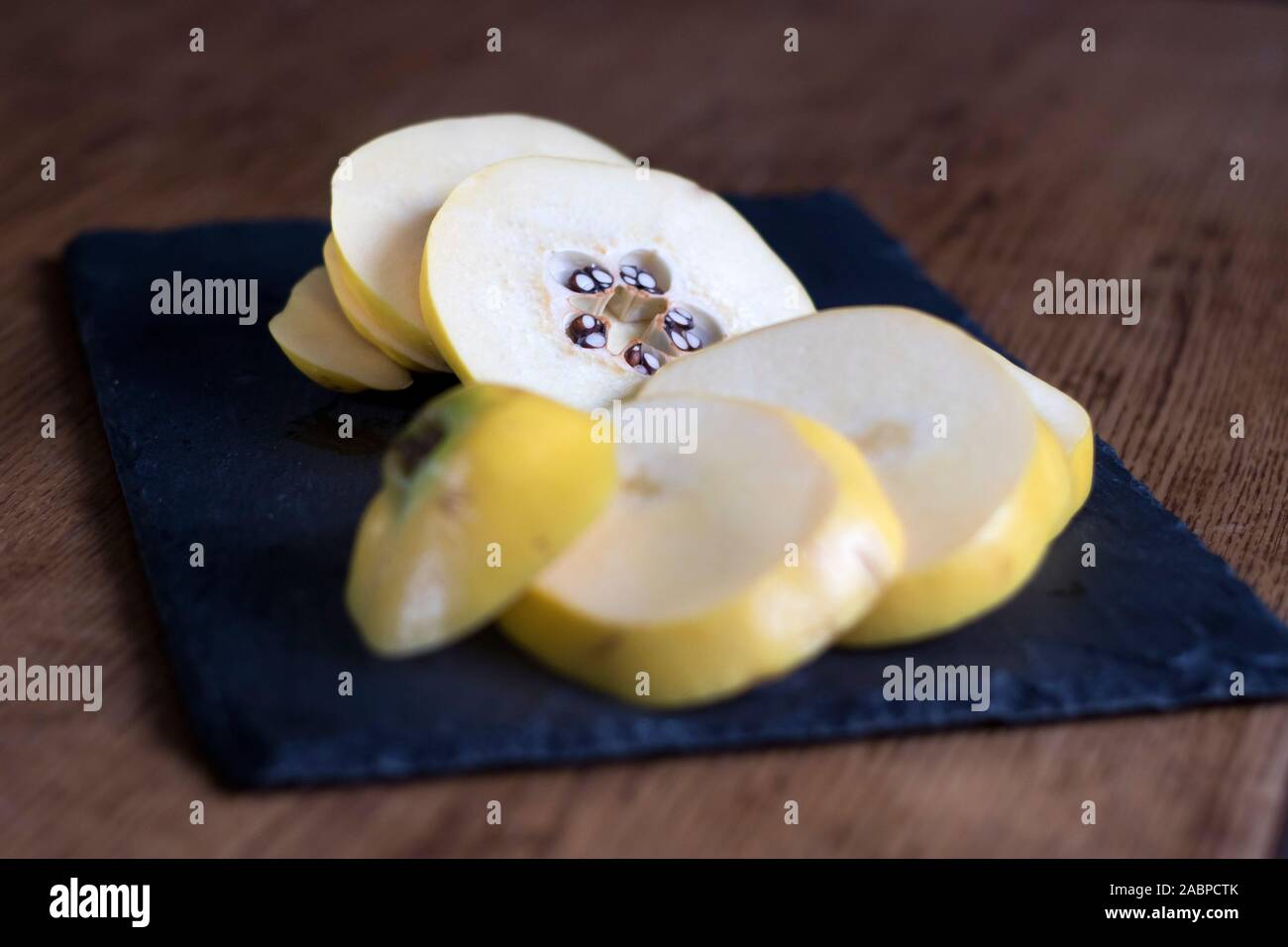 Sliced ripe quince as an ingredient for a meat dish Stock Photo - Alamy