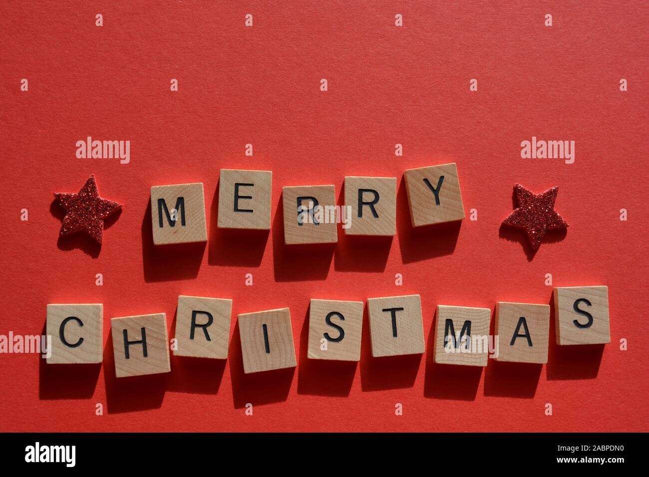 Merry Christmas in 3D wooden alphabet letters with red glitter stars on ...