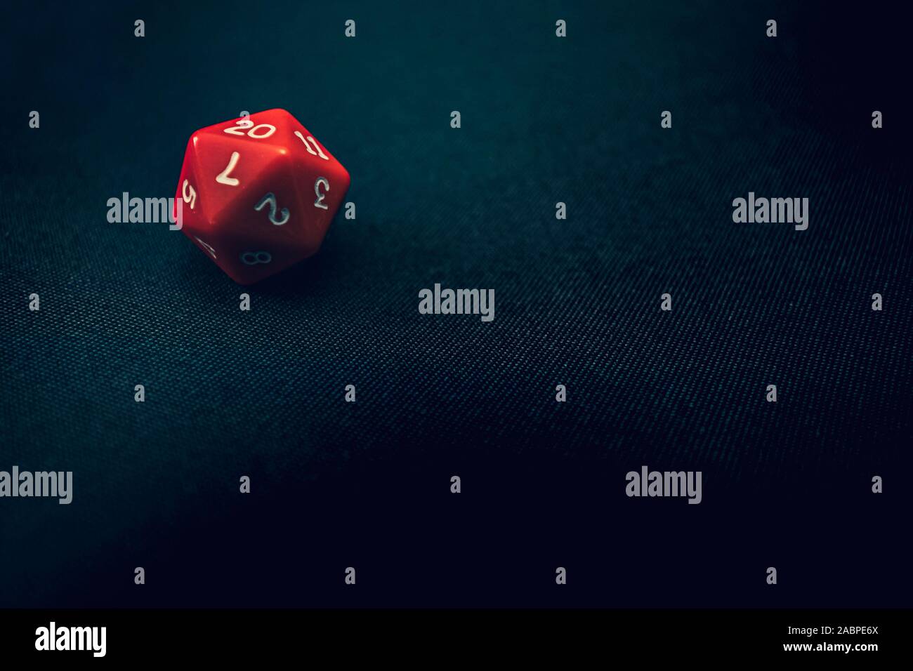 new 20 sided die with 20 faceing straight up Stock Photo - Alamy
