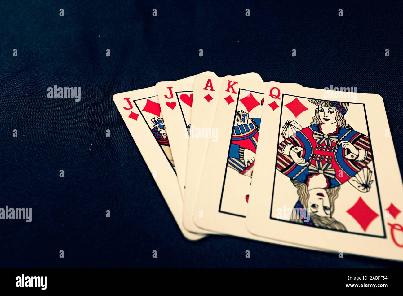 red euchre diamond hand on black background Stock Photo - Alamy