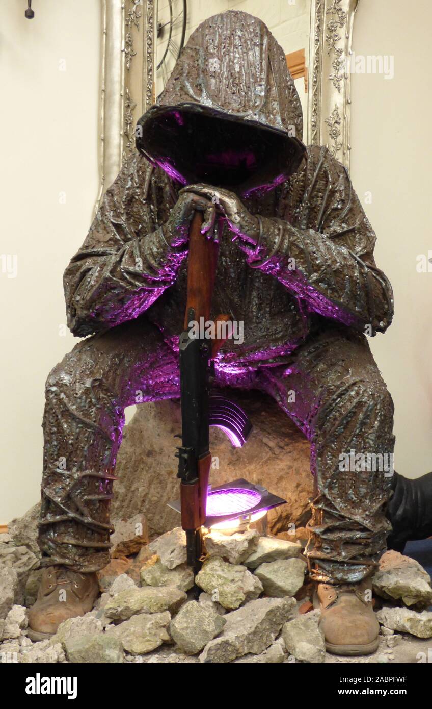 Hooded man with gun at the British Ironwork Centre and Shropshire ...