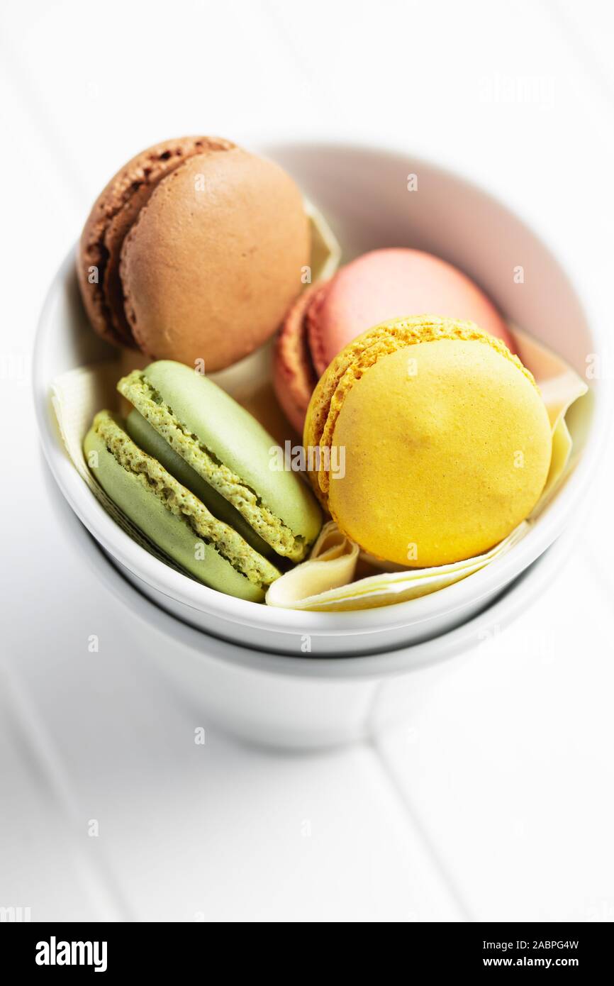 Sweet colorful macarons in bowl Stock Photo - Alamy