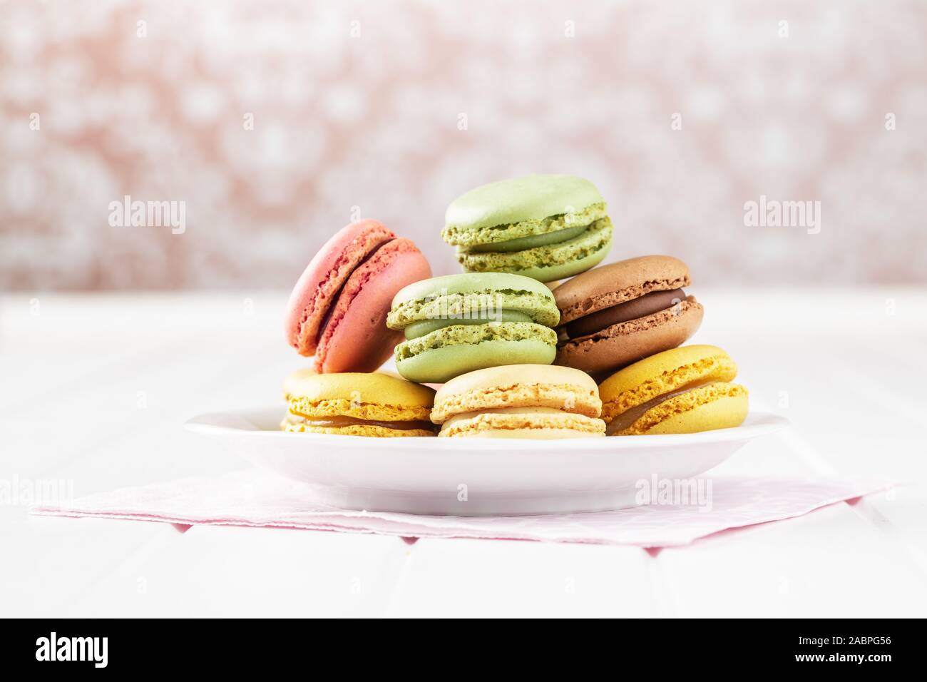 Sweet colorful macarons on plate Stock Photo - Alamy