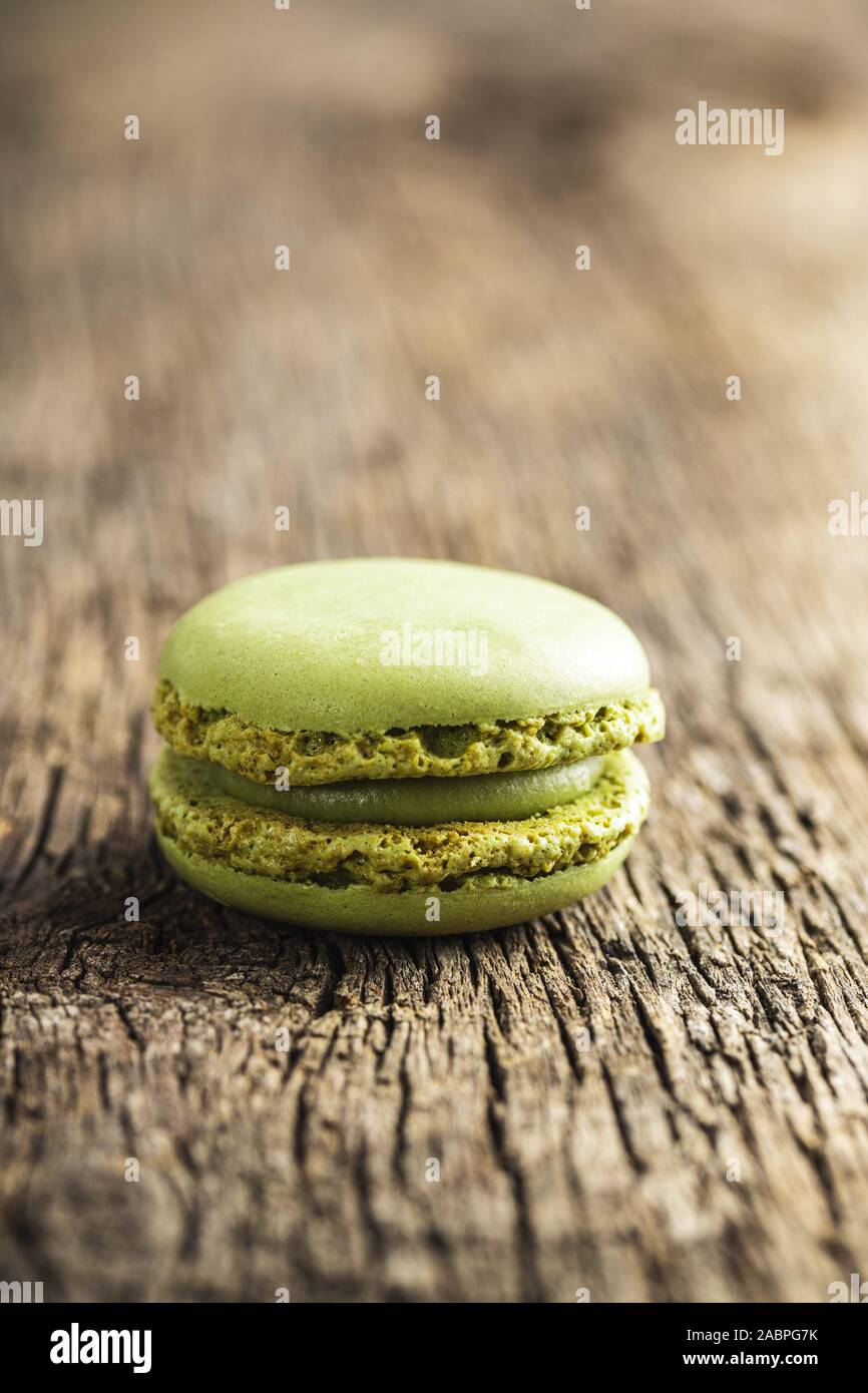 Sweet pistachio macarons on old wooden table Stock Photo - Alamy
