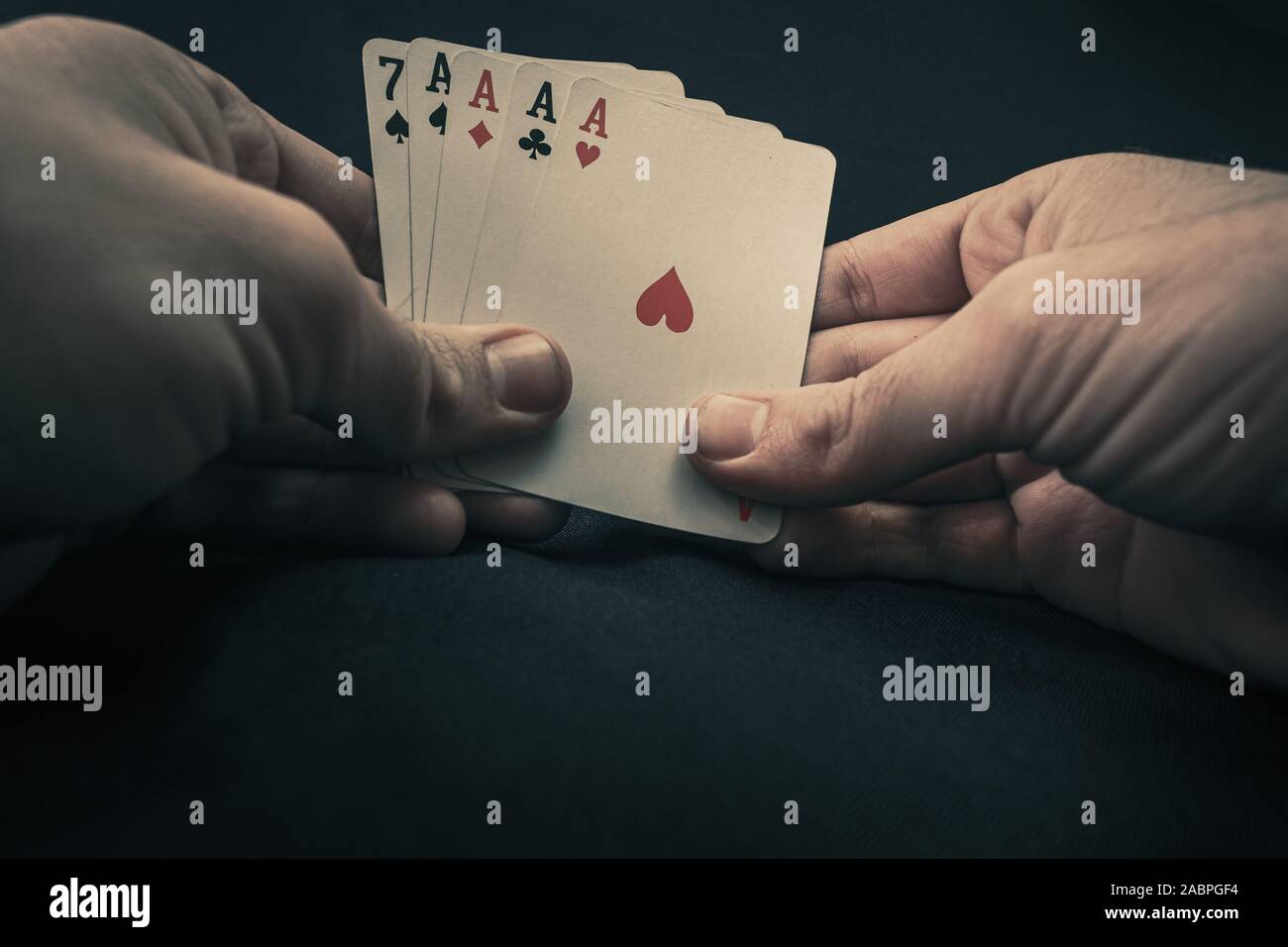 Poker hand holding aces hi-res stock photography and images - Alamy