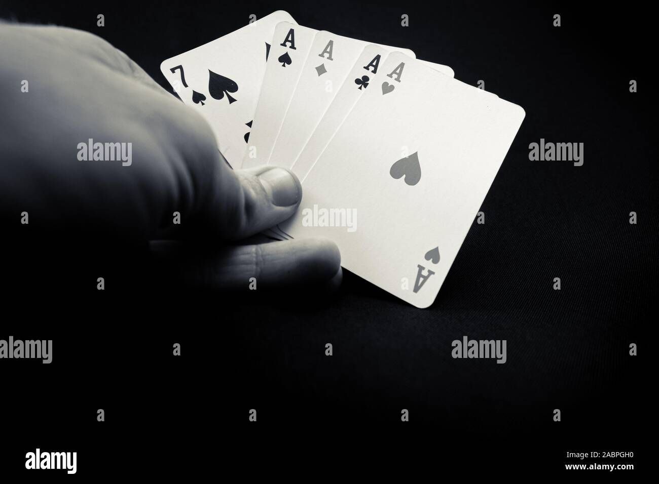Four aces in hand cards hi-res stock photography and images - Alamy