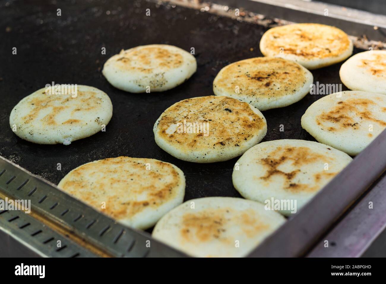 Arepas, Colombian corn patties filled with cheese, at a street food ...