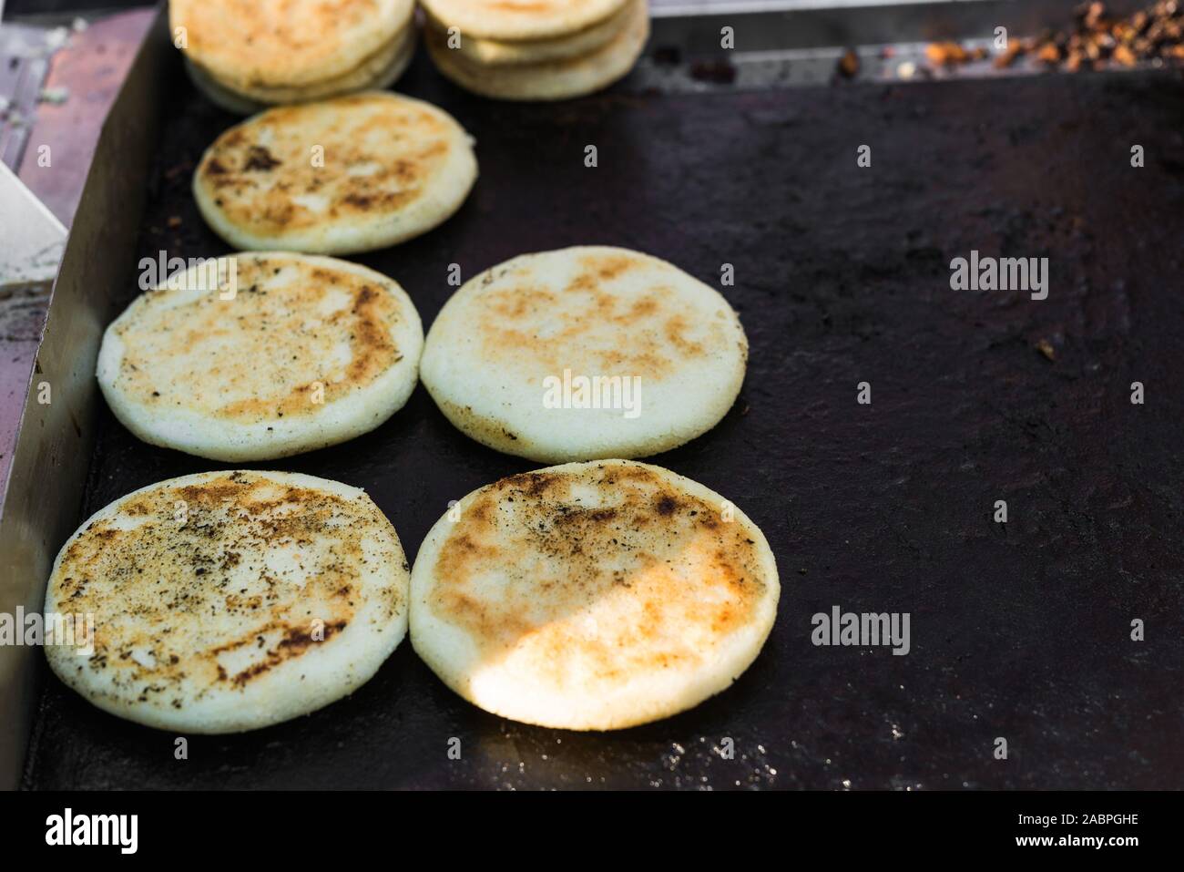 Arepas, Colombian corn patties filled with cheese, at a street food ...
