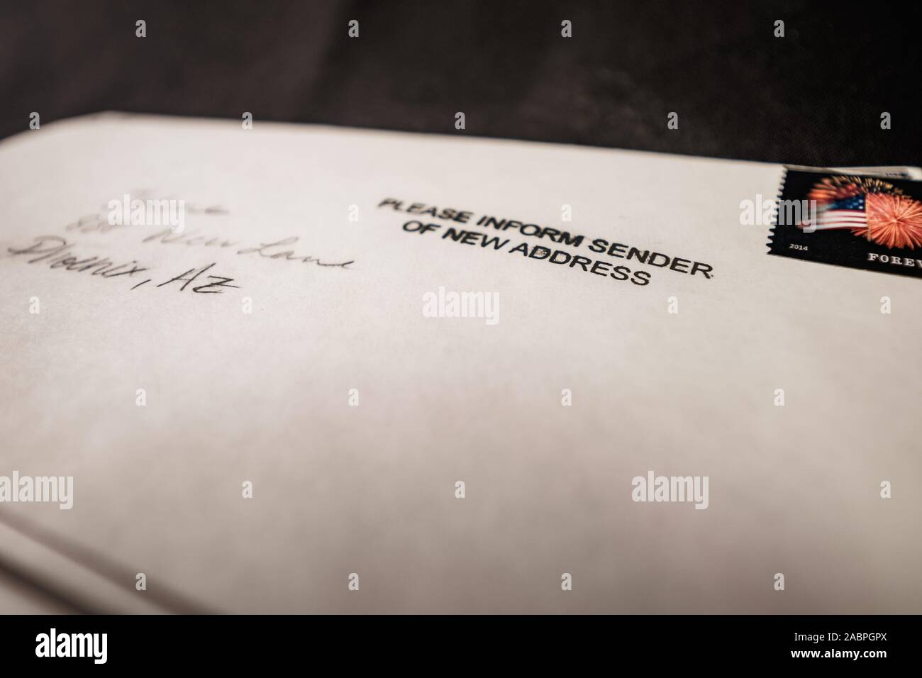white envelope with change of address stamp Stock Photo - Alamy