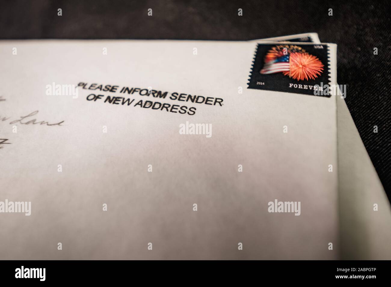 white envelope with change of address stamp Stock Photo - Alamy