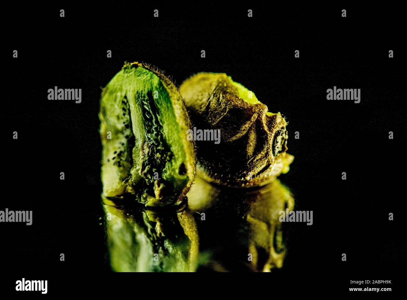 Rotten Fruit with slight decay on a reflective surface Stock Photo - Alamy