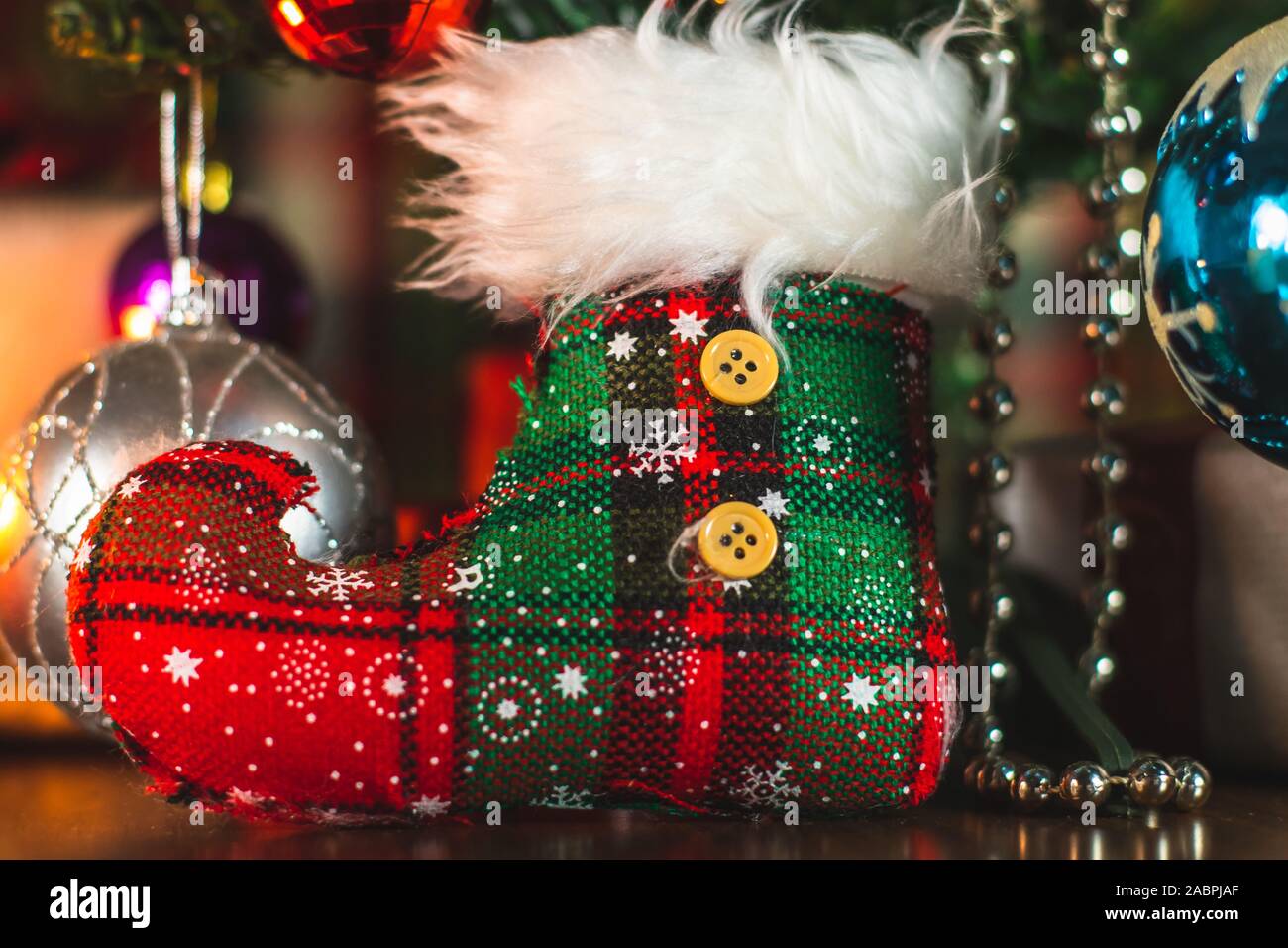 Christmas decorations and ornaments under a Christmas tree around the ...