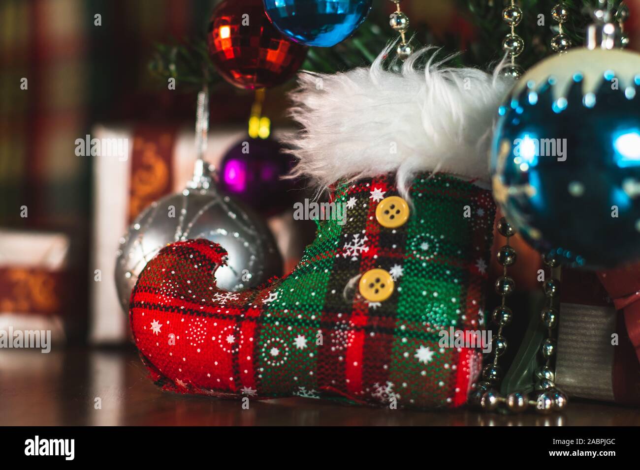 Christmas decorations and ornaments under a Christmas tree around the ...
