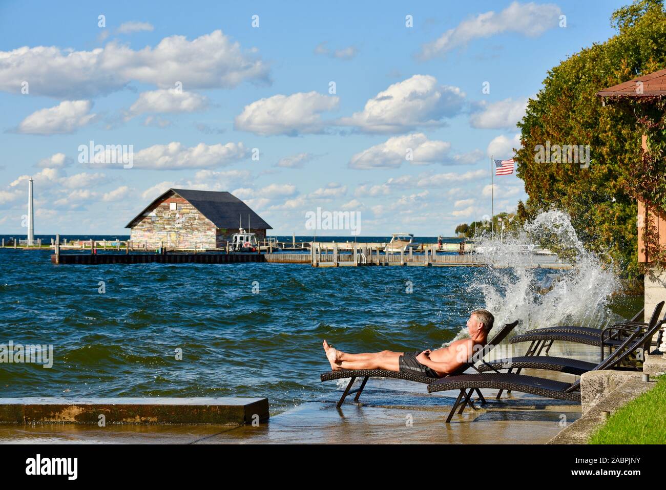 Man Sitting On Chair In Water High Resolution Stock Photography and ...