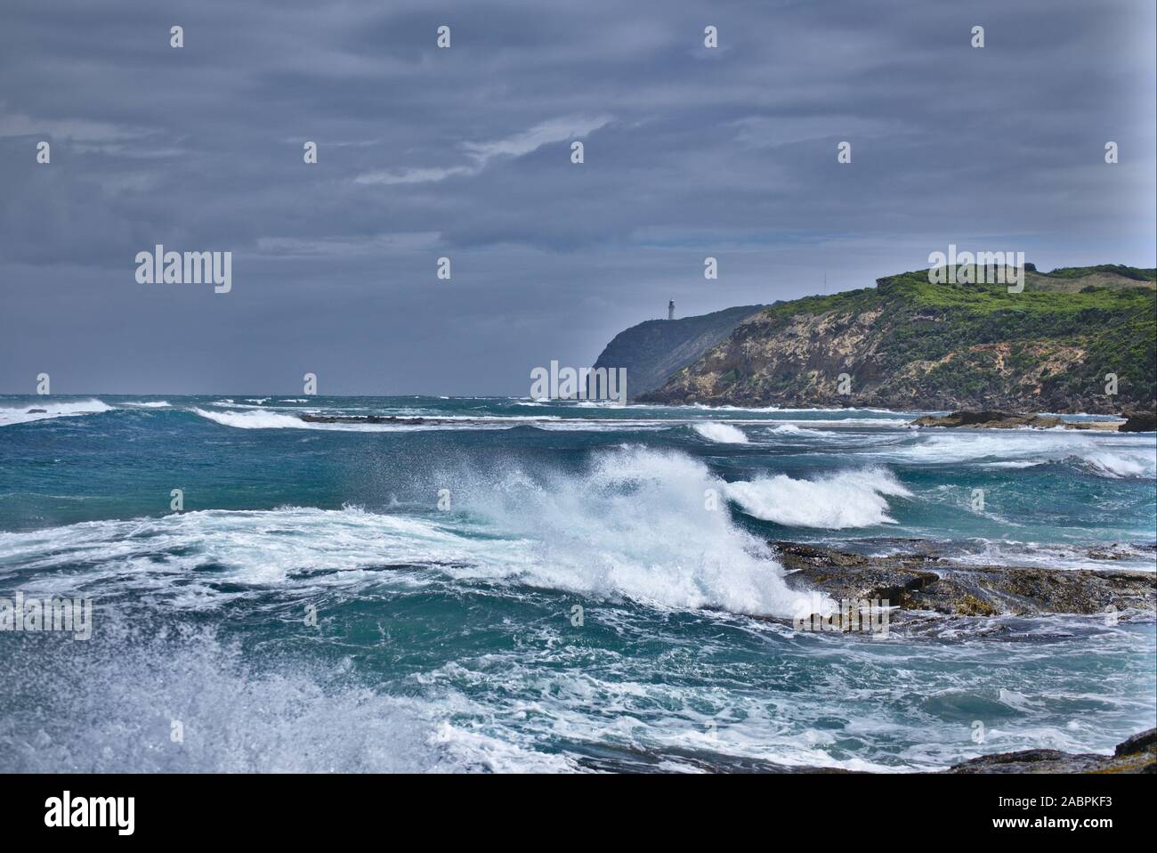 Landscape photo of rough seas with waves crashing in the foreground and ...