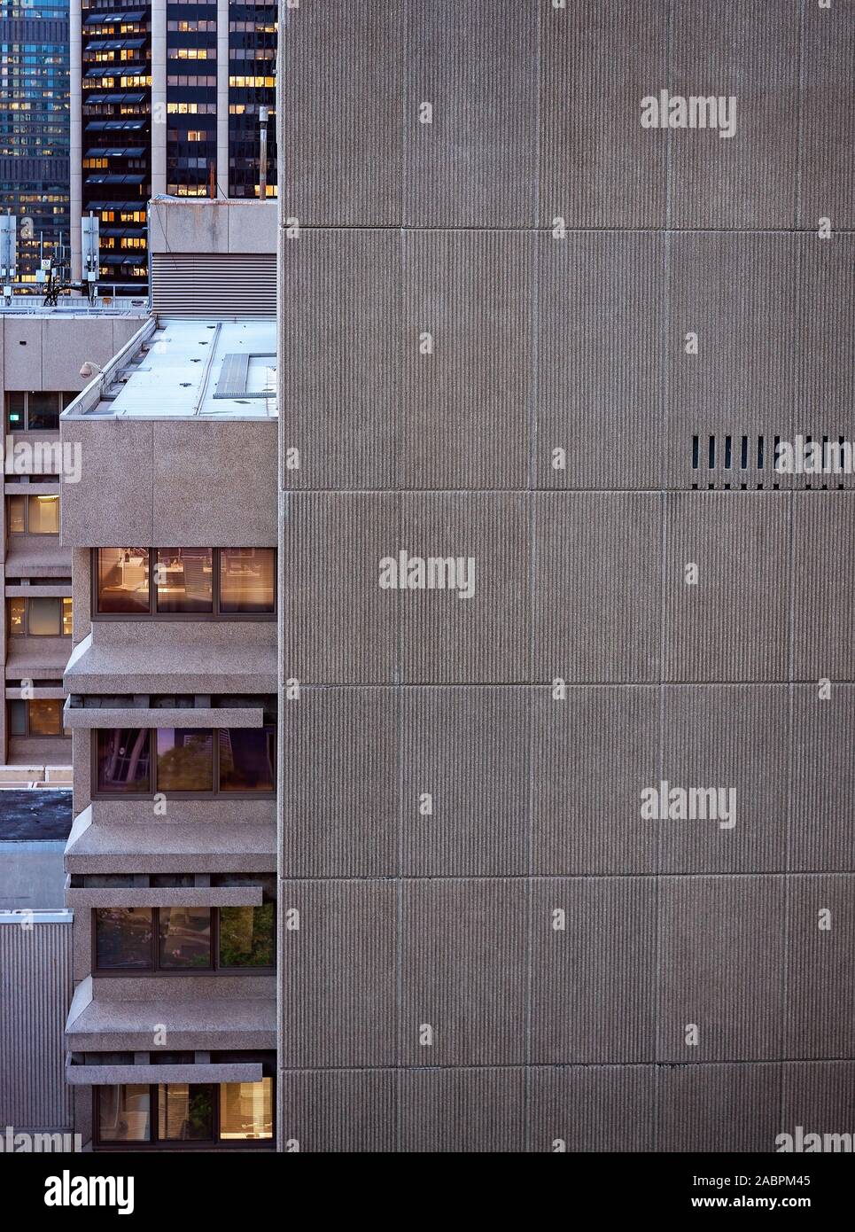 Blank concrete wall of building against a skyscraper of offices Stock ...