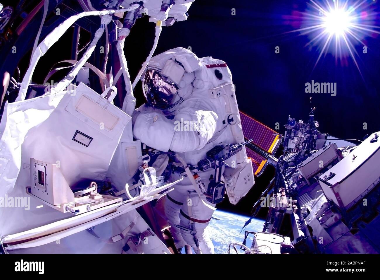 Astronaut at the space station is engaged in repairs. Elements of this ...