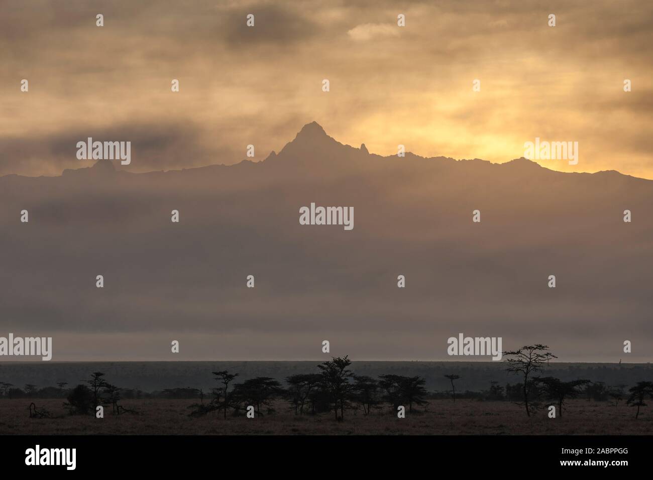 view of Mount Kenya, at sunrise from a distance, clouds in the ...
