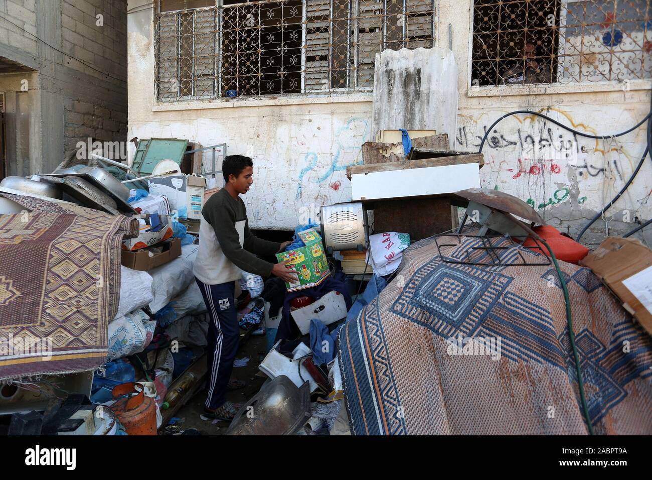 A young Palestinian man collects used tools and sells them in markets ...