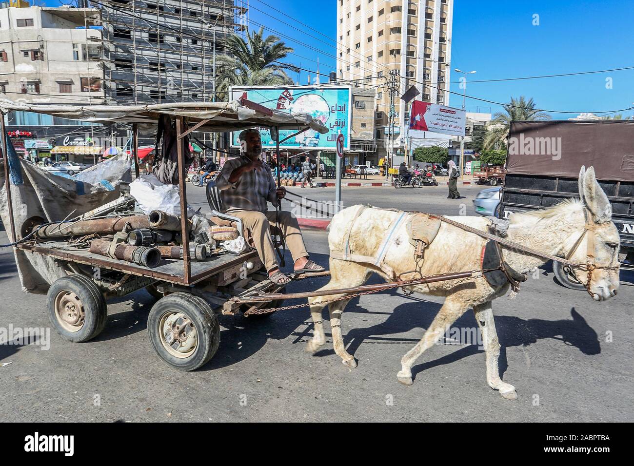 A young Palestinian man collects used tools and sells them in markets ...