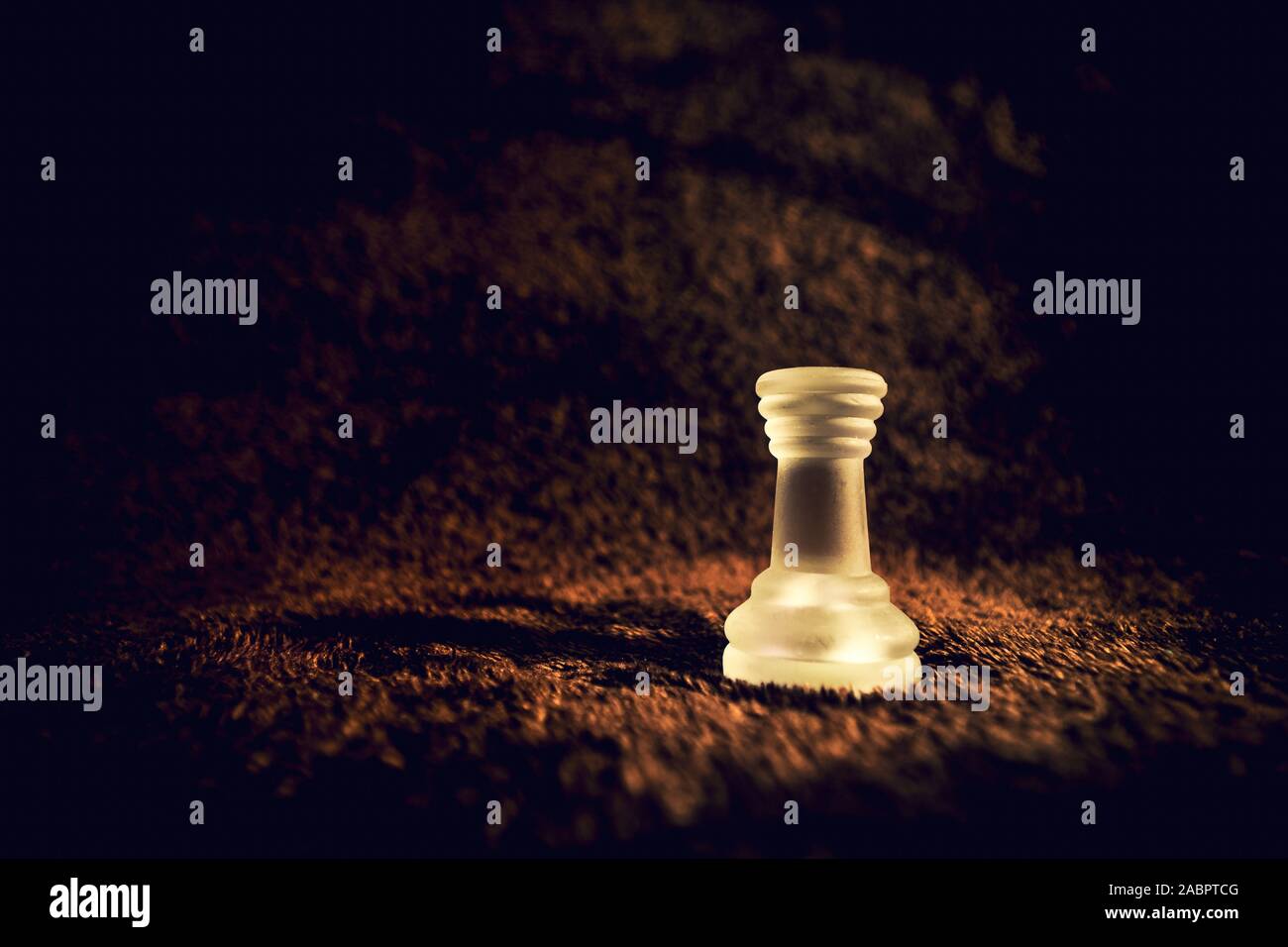 Frosted Rook chess piece on dramatic background Stock Photo - Alamy