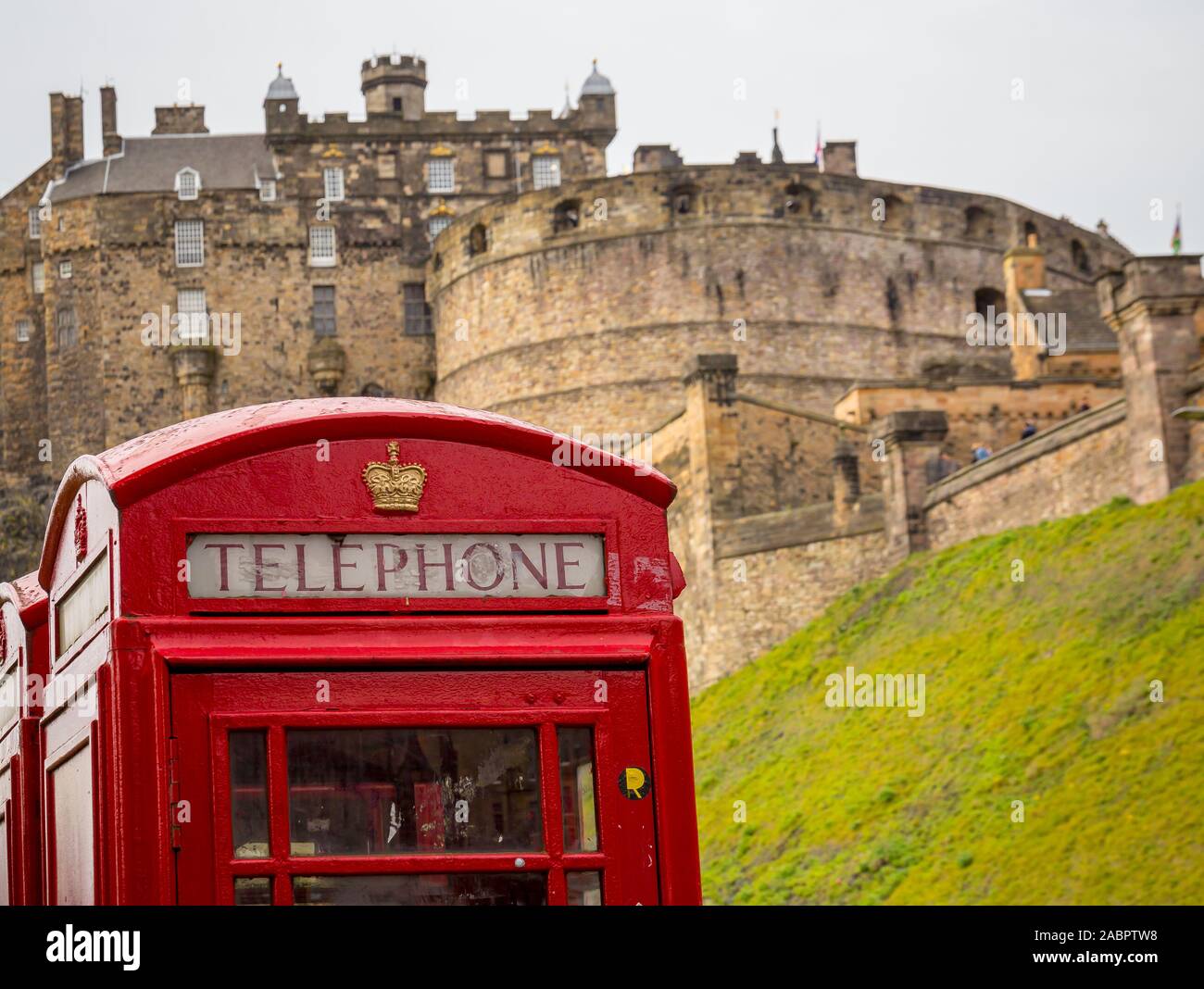English phone booth on edinburgh castle background Stock Photo - Alamy