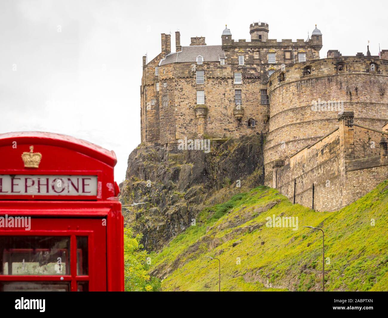 English phone booth on edinburgh castle background Stock Photo - Alamy