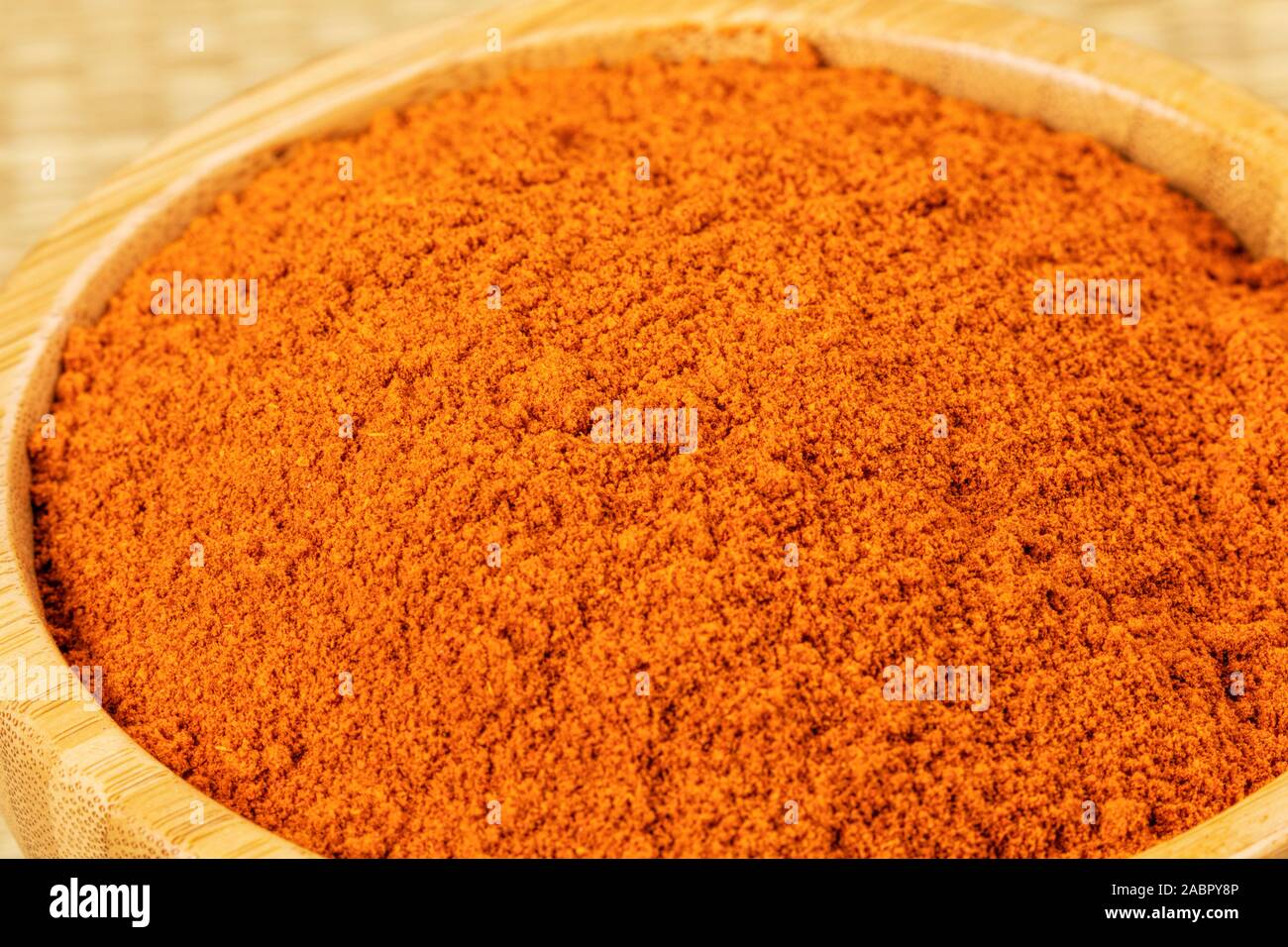 Bowl full of Chili Powder on a bamboo background Stock Photo - Alamy