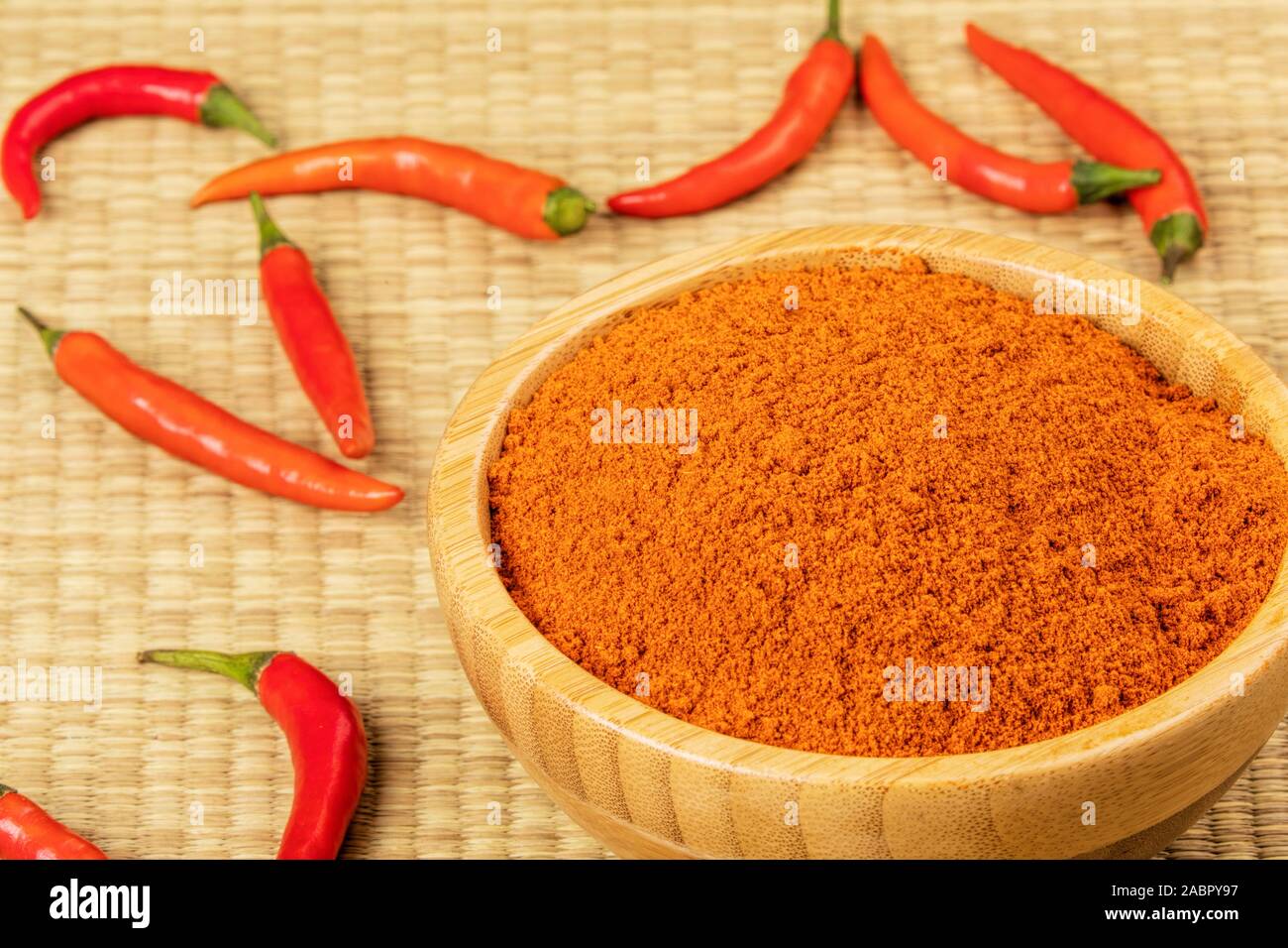 Bowl full of Chili Powder on a bamboo background Stock Photo - Alamy