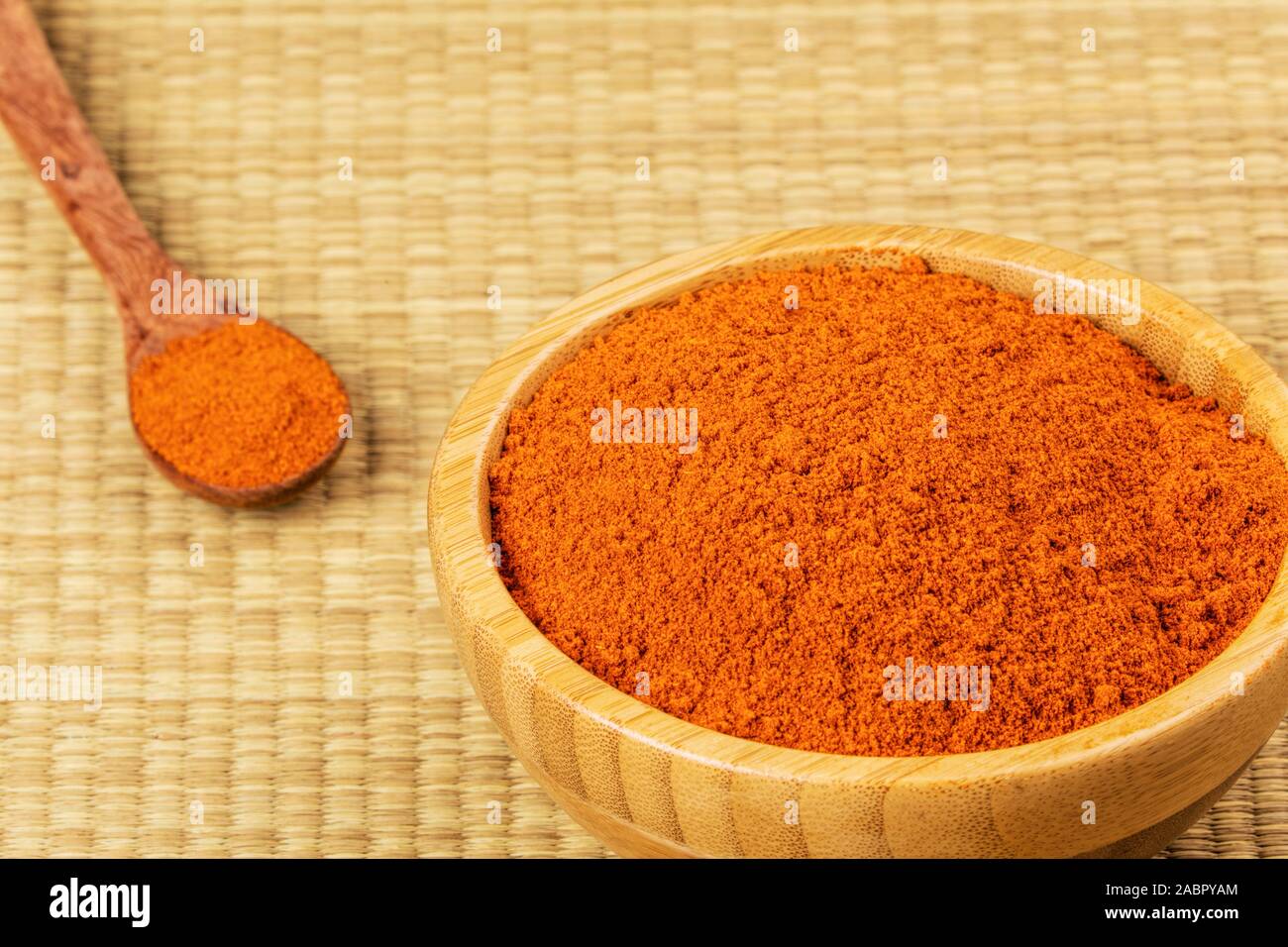 Bowl full of Chili Powder on a bamboo background Stock Photo - Alamy