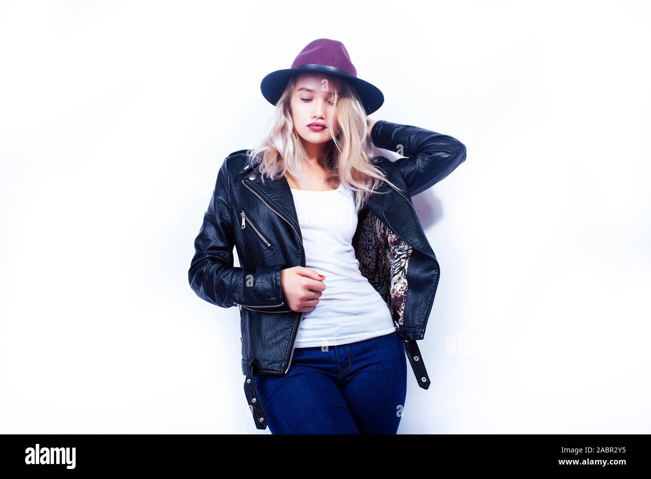 young pretty blond girl hipster in hat posing smiling happy isolated on ...