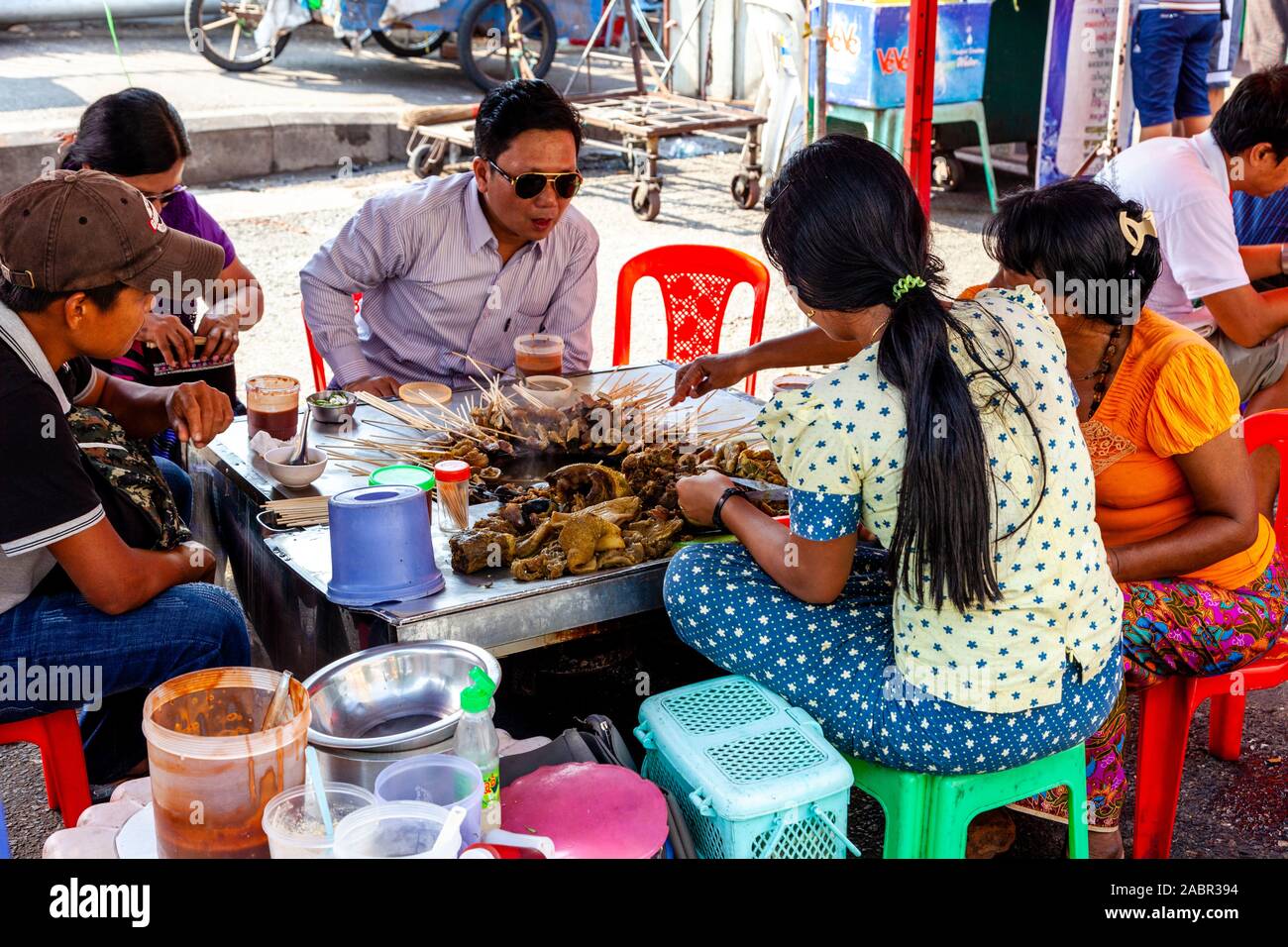 People Eating Street Food From A Stall In Downtown Yangon, Yangon ...