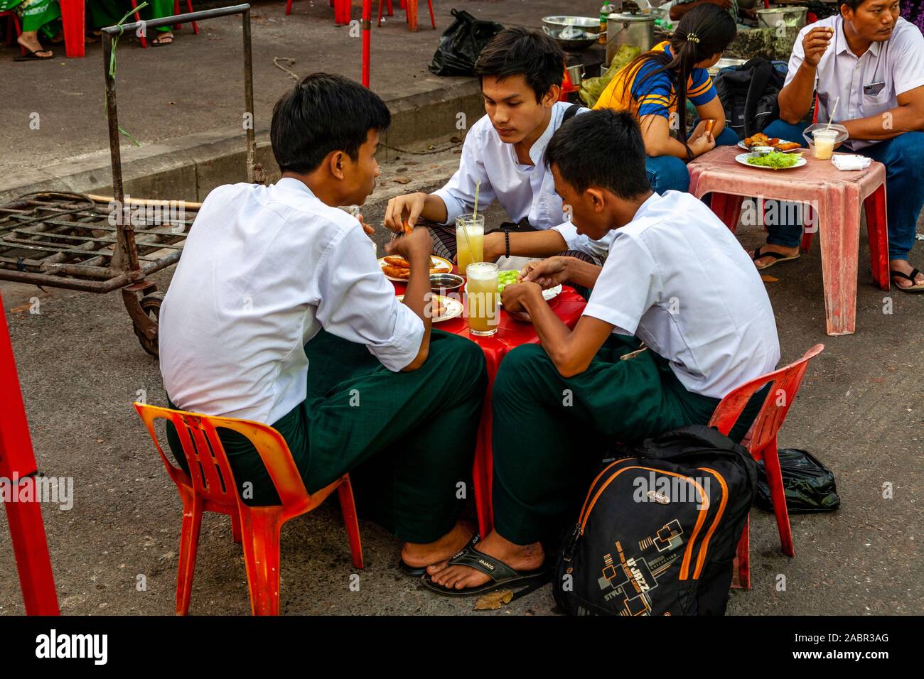 Group young people eating traditional hi-res stock photography and ...
