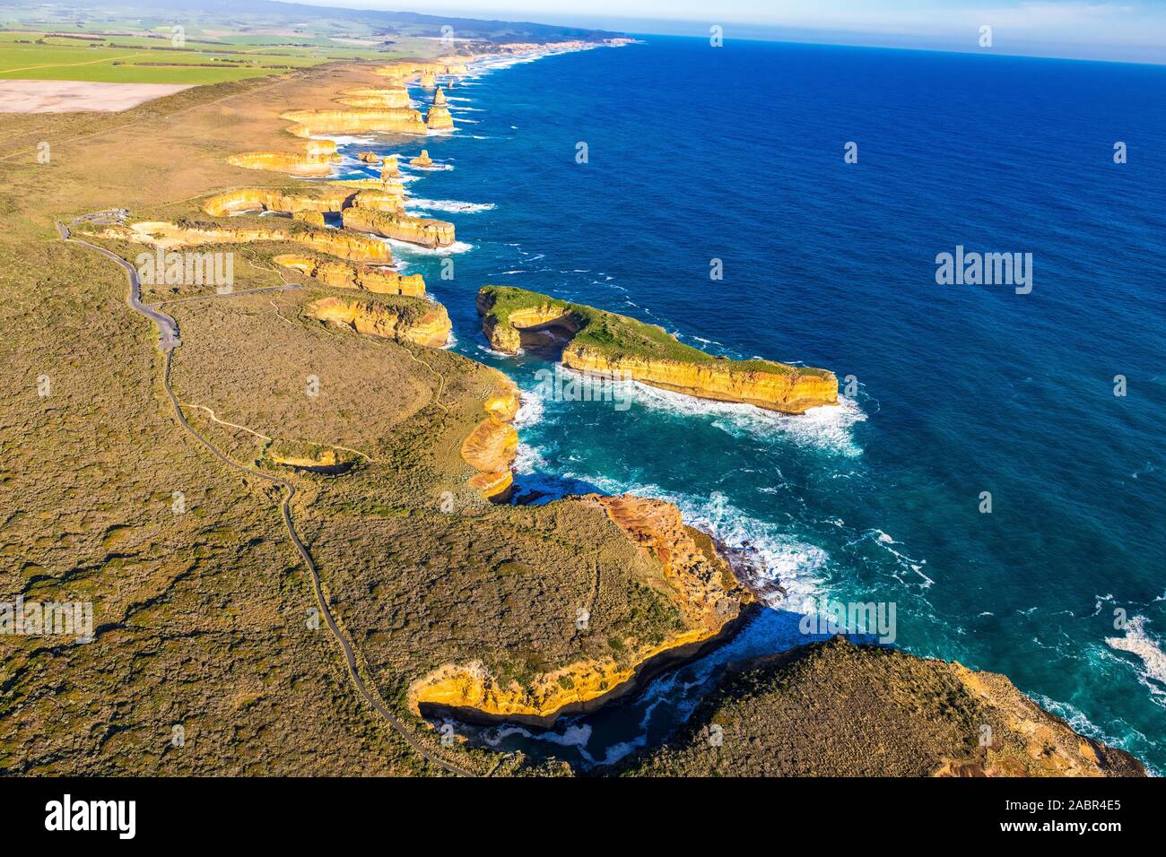 Aerial view of the Great Ocean Road and Muttonbird Island within Port ...