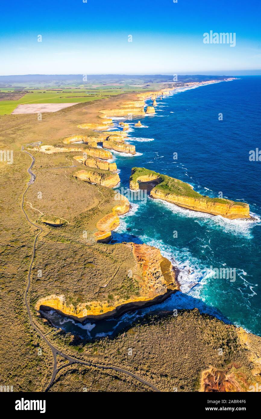 Aerial view of the Great Ocean Road and Muttonbird Island within Port ...